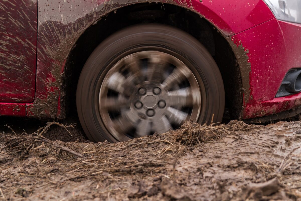 Muddy Mishaps: How to Handle a Car Stuck In Mud - In The Garage with ...